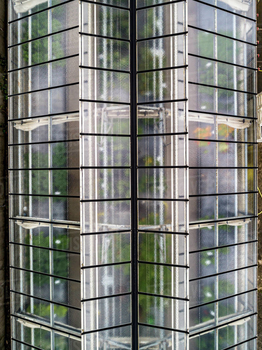 Aerial view from above sloped greenhouse roofs, Germany - Royalty-free ...