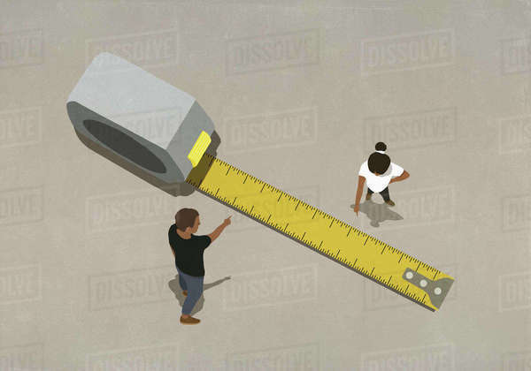 Couple with large tape measure - Royalty-free Stock Photo | Dissolve