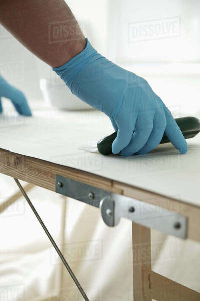 Close up of man's hands applying wallpaper paste - Royalty-free Stock ...