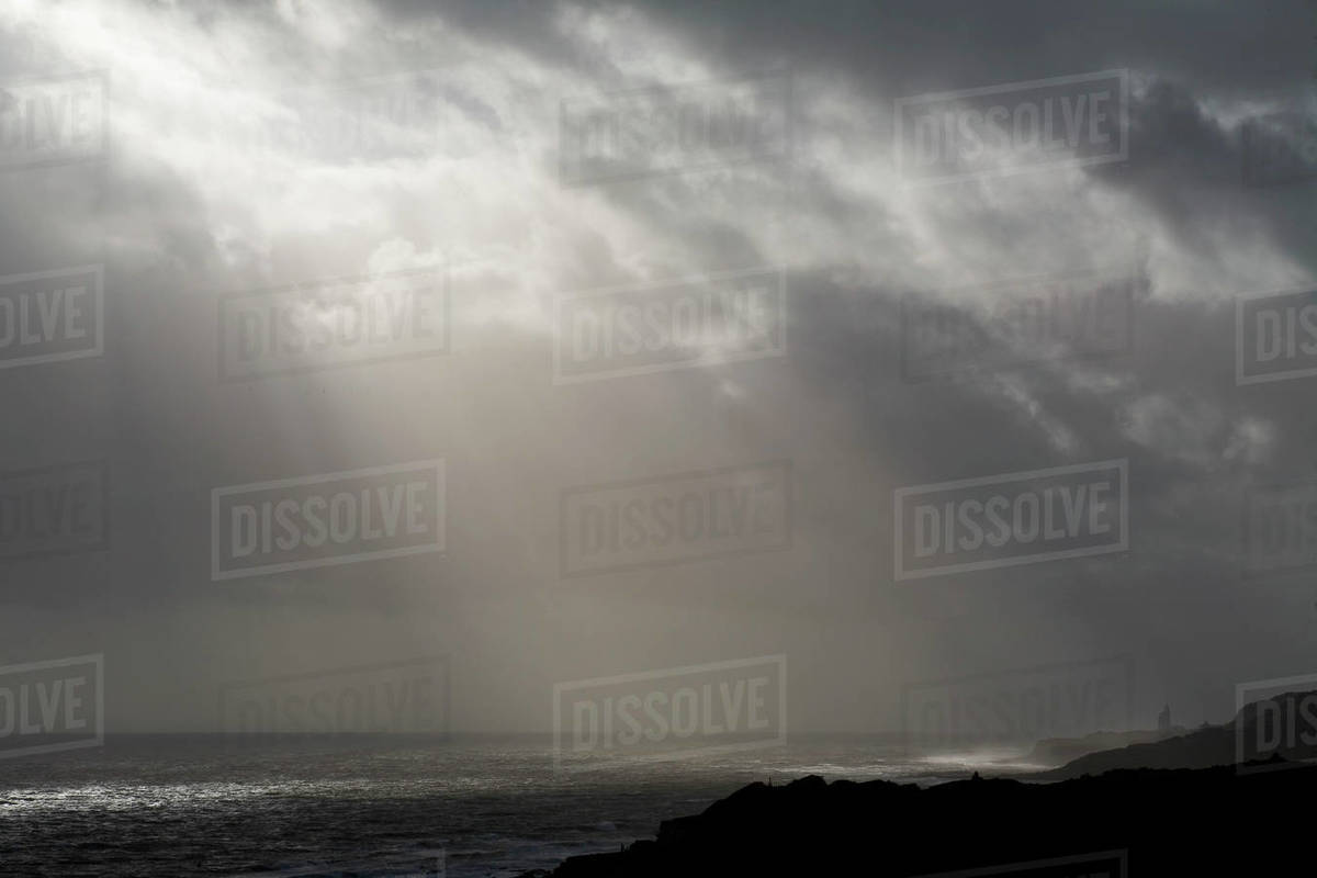 Grey sky with sun rays and thunder, United Kingdom, England - Royalty ...
