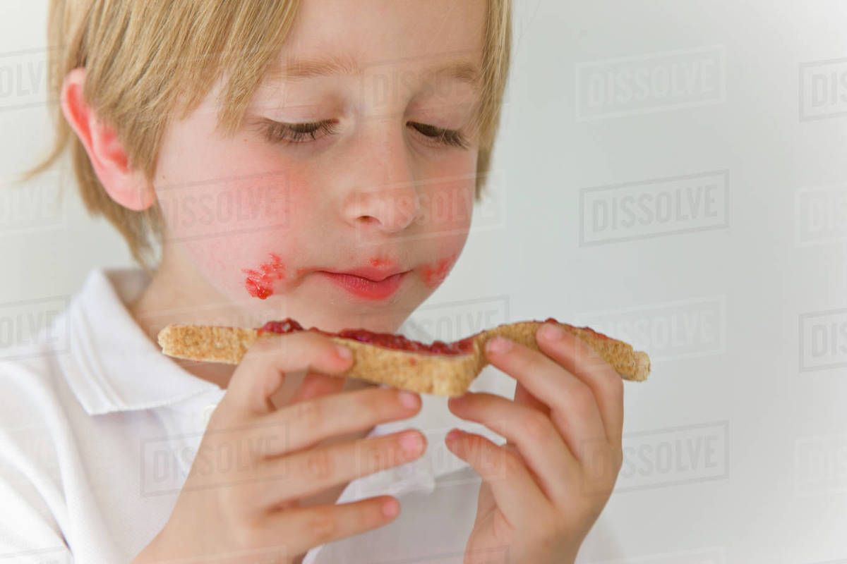 Boy Eating Jam on Toast - Royalty-free Stock Photo | Dissolve