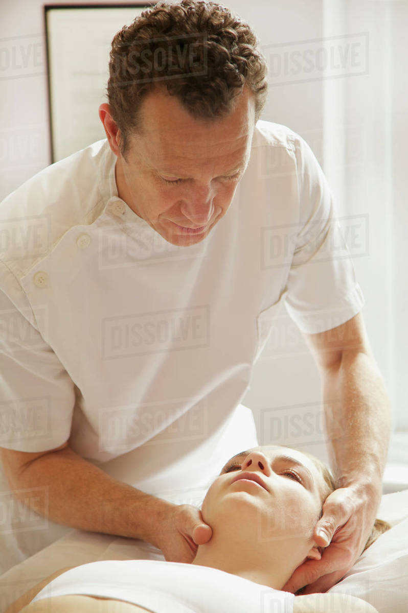 Osteopath Treating Female Patient - Royalty-free Stock Photo | Dissolve
