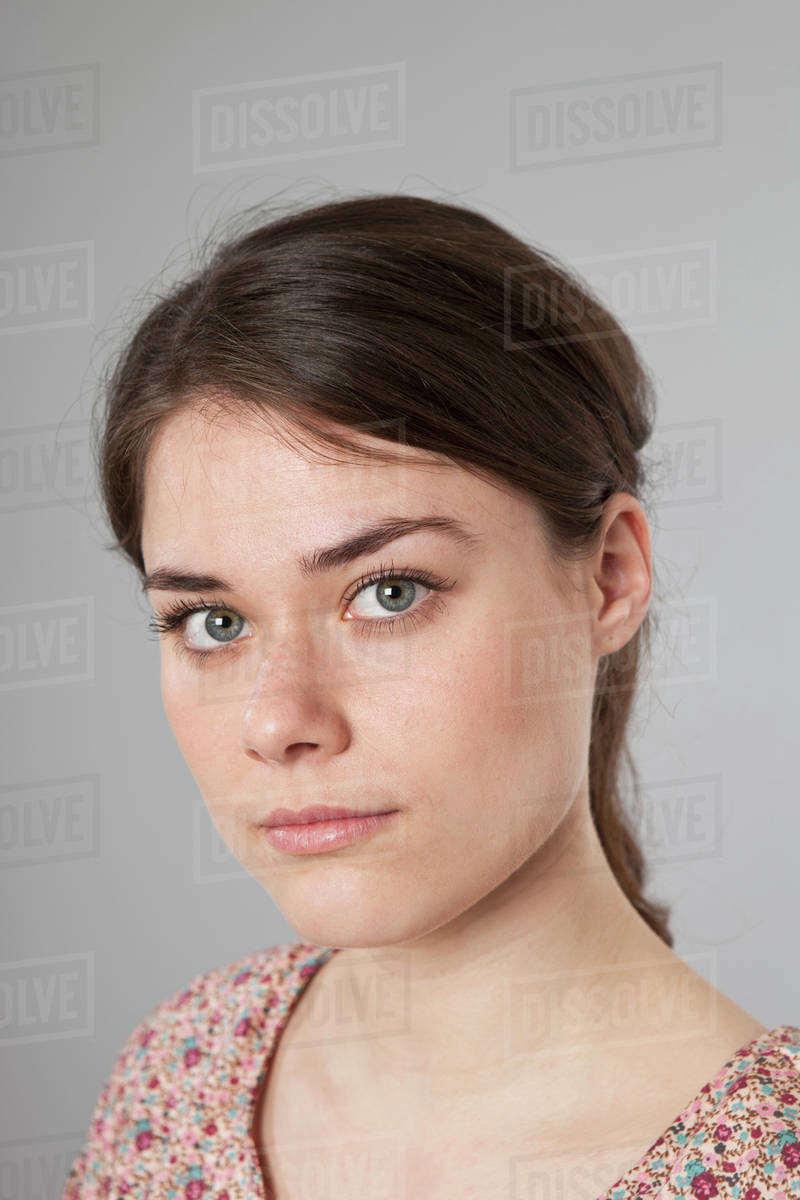 A woman looking seriously into the camera - Royalty-free Stock Photo ...