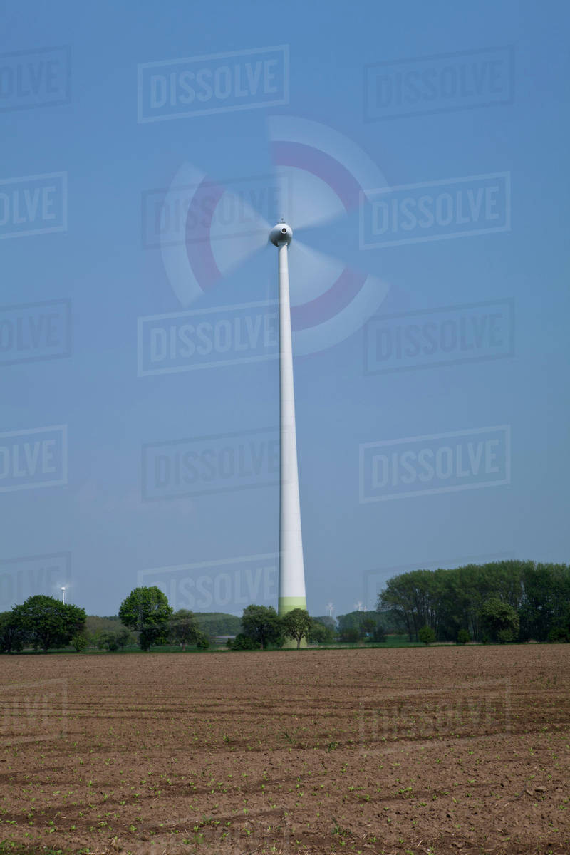 A spinning wind turbine - Stock Photo - Dissolve