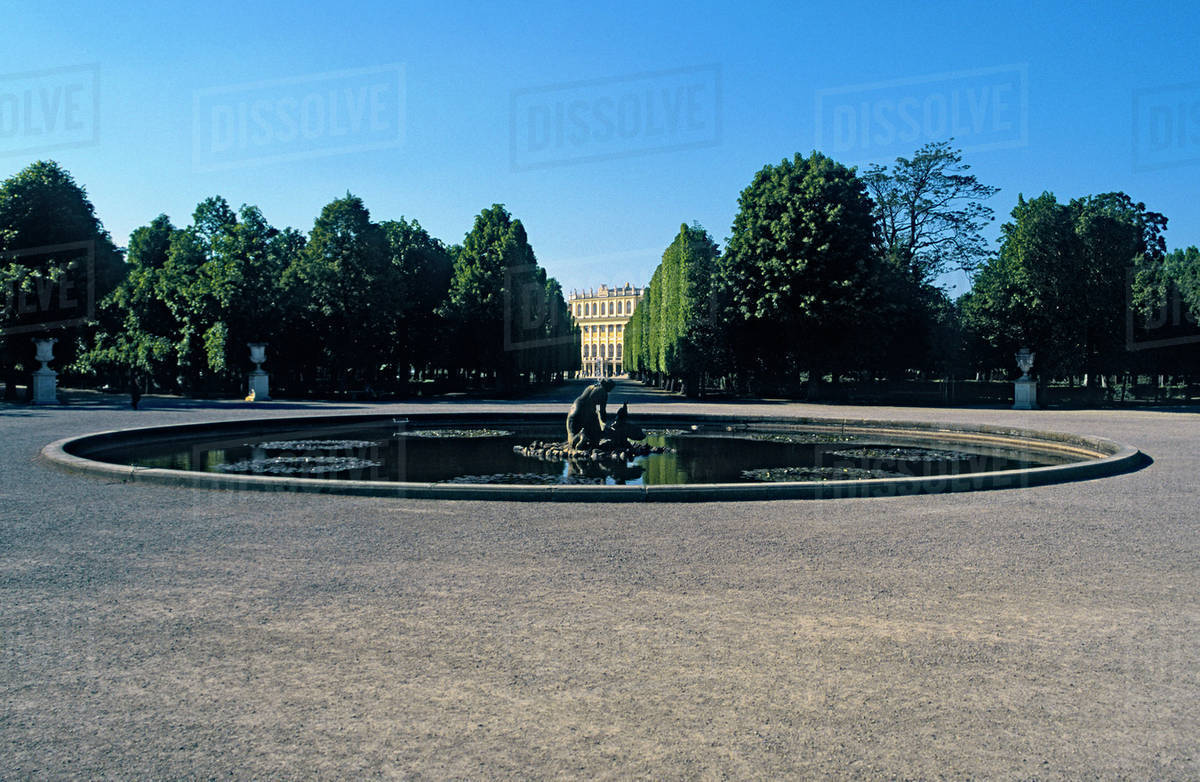 Austria, Vienna, water fountain with Schonbrunn Palace seen far in the ...