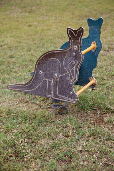 A kangaroo children's spring ride at a playground - Stock Photo - Dissolve